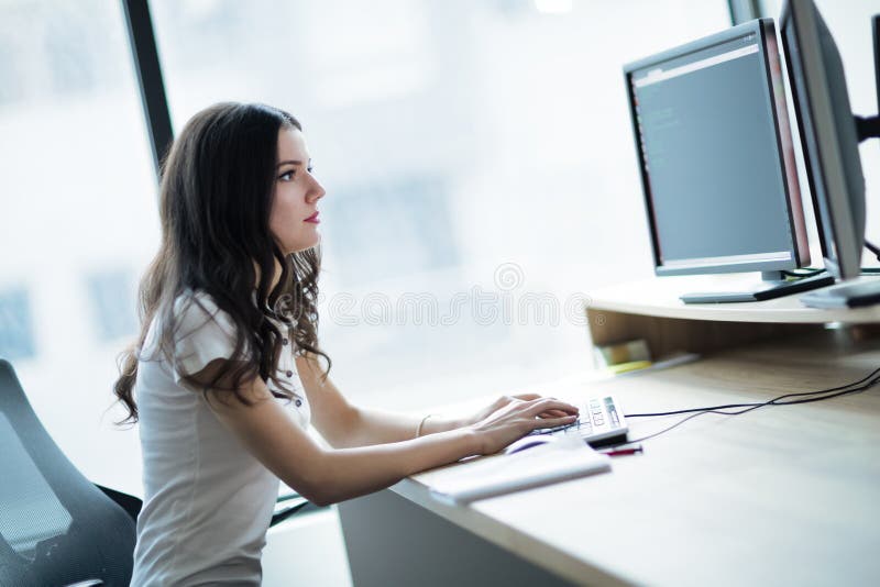 Beautiful Female Using Computer in Office Stock Image - Image of laptop ...