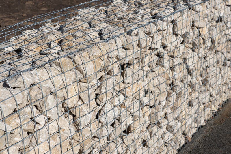 A Beautiful Fence Made of Metal Mesh and Stones Inside. the Original ...