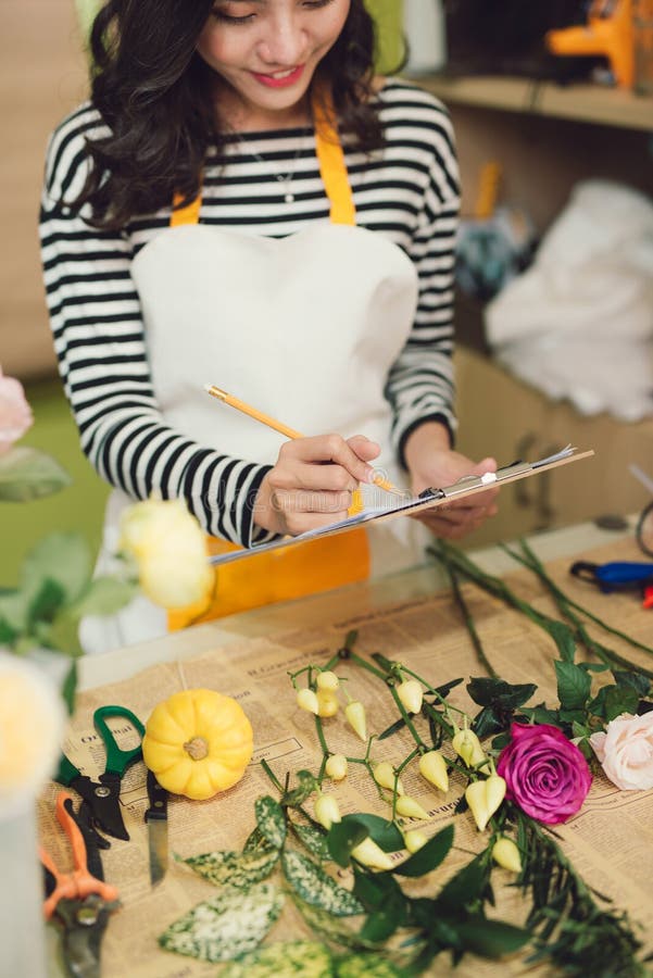 Beautiful Florist Woman Holds a Bouquet Stock Photo - Image of standing ...