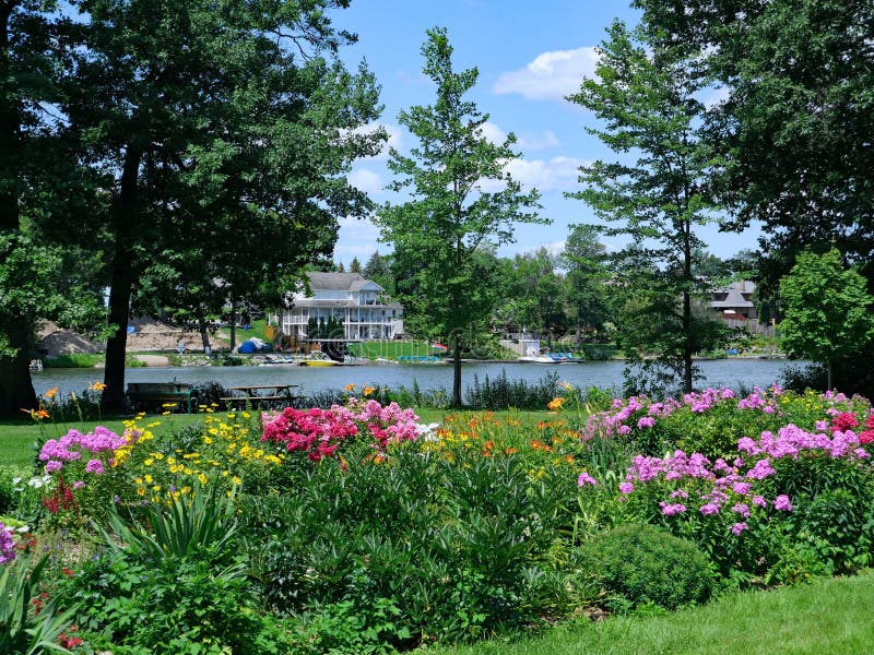 Beautiful Flower Garden beside Lake Stock Photo - Image of boat ...