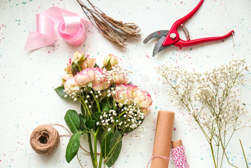 Beautiful Flowers with Supplies of Florist on Light Table Stock Image ...