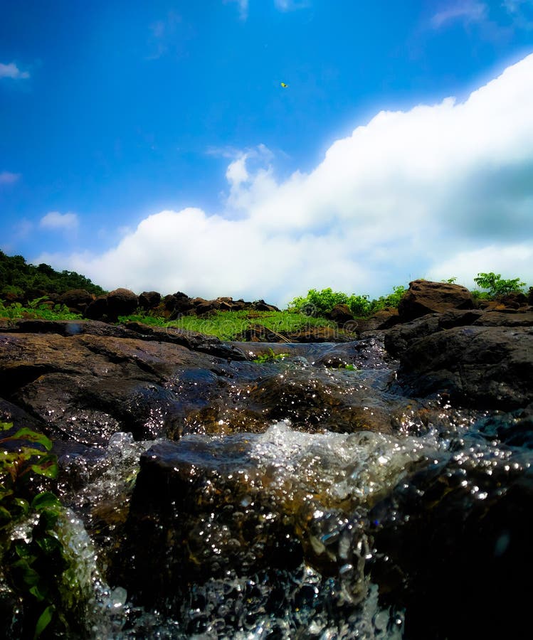 Beautiful Flowing Small River Rock with Mountain Blue Sky Clouds Stock ...