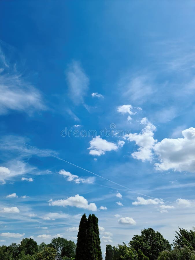 Beautiful Fluffy White Cloud Formations in a Deep Blue Summer Sky Stock ...