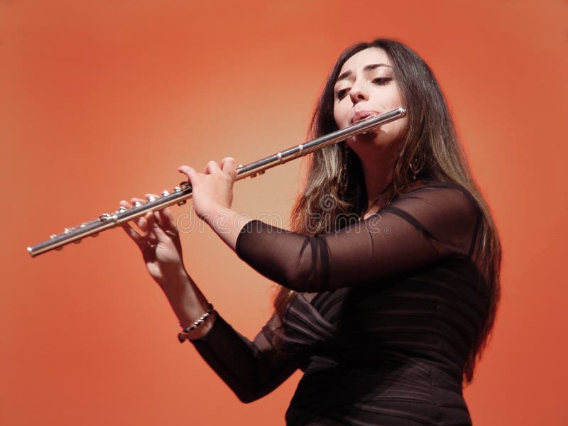 Beautiful Flutist stock image. Image of melody, enjoy, enjoying - 92363