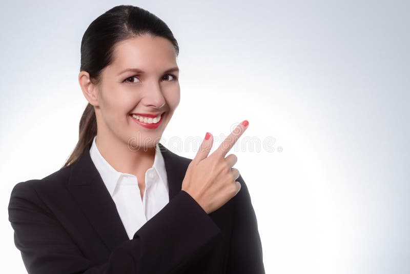Beautiful Friendly Manageress Pointing To Copy Space Stock Photo ...