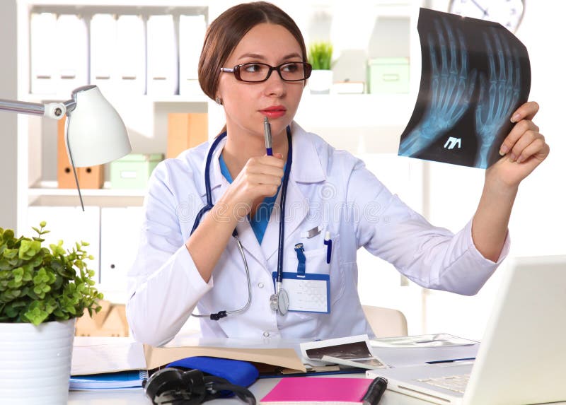 Beautiful General Practitioner is Working with Joy. she is Standing ...