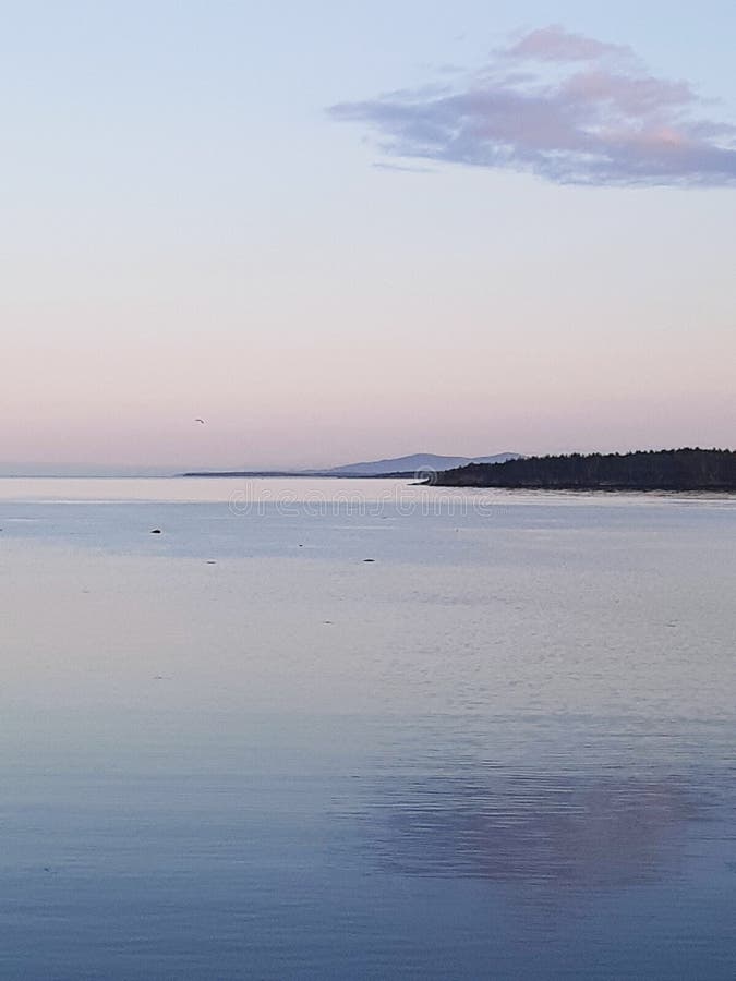 Beautiful Gentle Sunset on the Sea Coast with Clouds Reflected in the ...