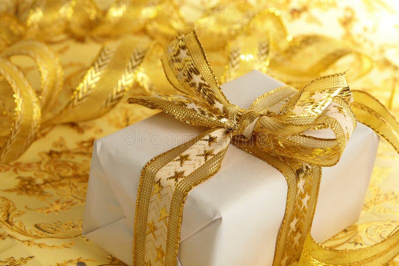 Gift Box in Gold Wrapping Paper with Autumn Leaves Stock Photo - Image ...