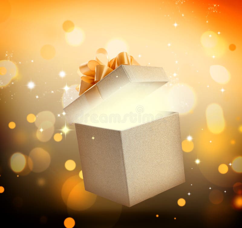 Beautiful Gift Box with Magic Light on Color Background Stock Photo ...
