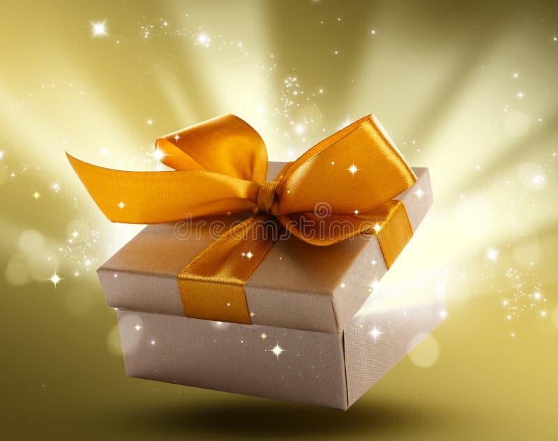 Beautiful Gift Box with Magic Light on Golden Background Stock Image ...