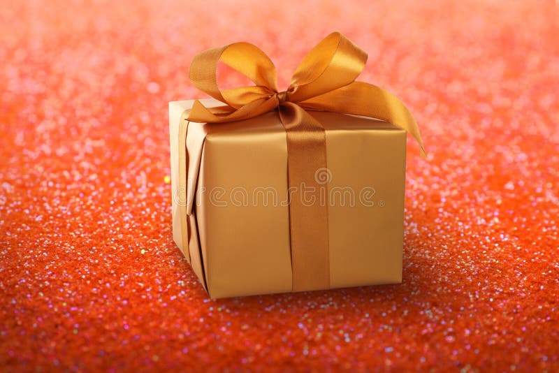 Beautiful Gift Box on Shiny Red Glitters. Bokeh Effect Stock Image ...
