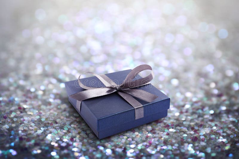 Beautiful Gift Box on Shiny Silver Glitters. Bokeh Effect Stock Image ...