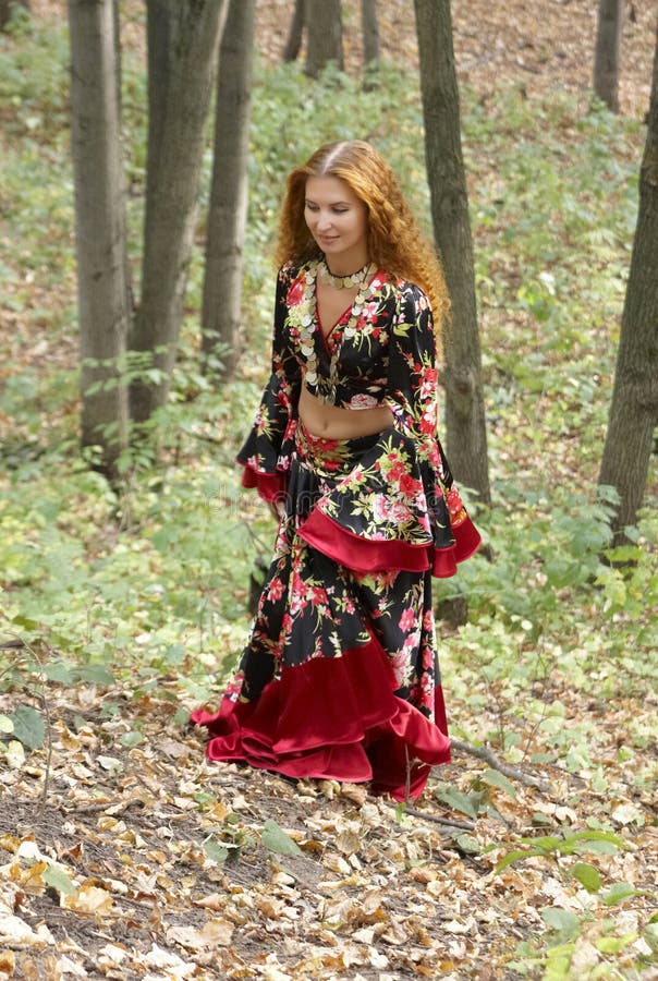 A Beautiful Ginger-haired Girl in Gipsy Suit Stock Photo - Image of ...