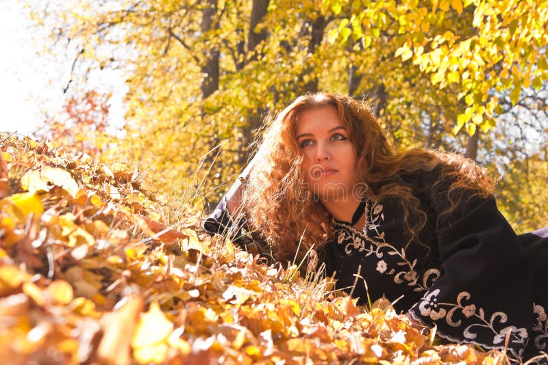 A Beautiful Ginger-haired Woman in Fall Forest Stock Photo - Image of ...