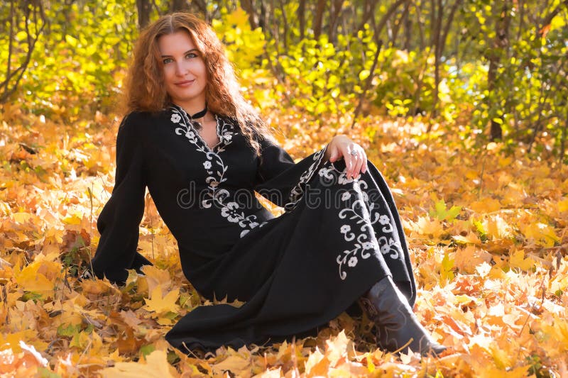 A Beautiful Ginger-haired Woman in Fall Forest Stock Photo - Image of ...