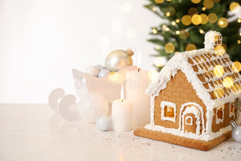 Beautiful Gingerbread House Decorated with Icing and Candles on White ...