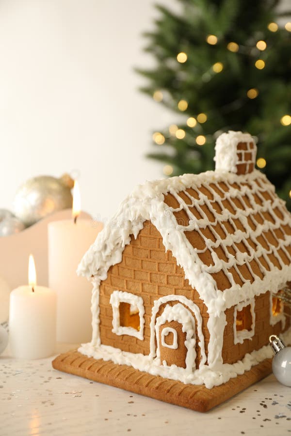 Beautiful Gingerbread House Decorated with Icing and Candles on White ...