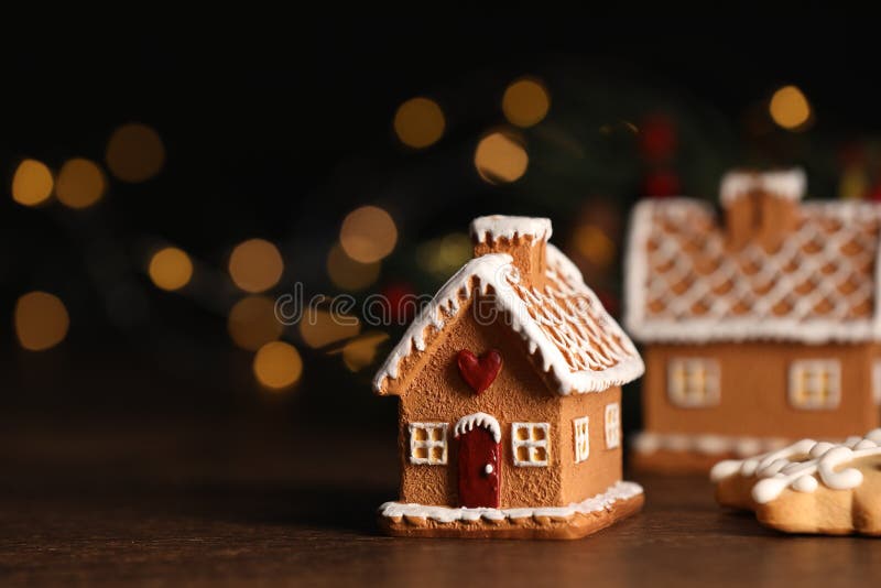 Beautiful Gingerbread Houses with Icing on Wooden Table, Space for Text ...