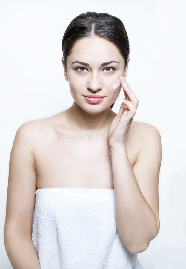 Beautiful Girl Apply Cream on the Face during a Spa Stock Photo - Image ...
