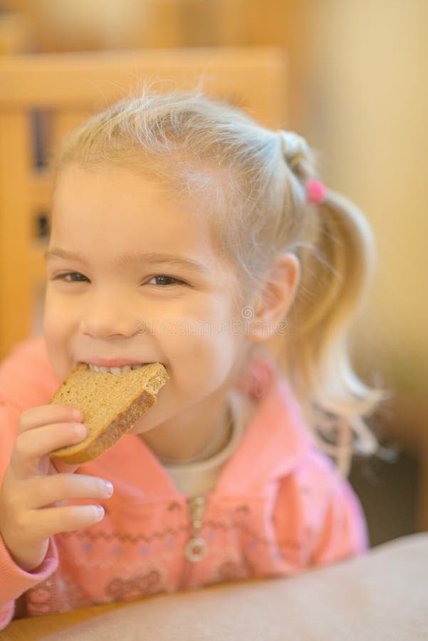 Beautiful Girl Biting Bread. Stock Image - Image of hungry, human: 32082791