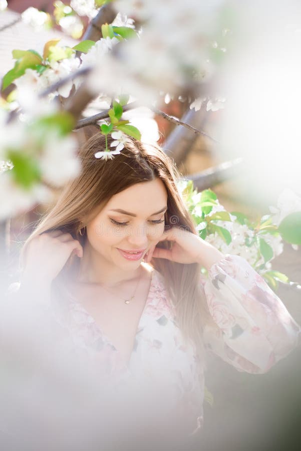 A Beautiful Girl in a Blooming Spring Garden. Stock Photo - Image of ...