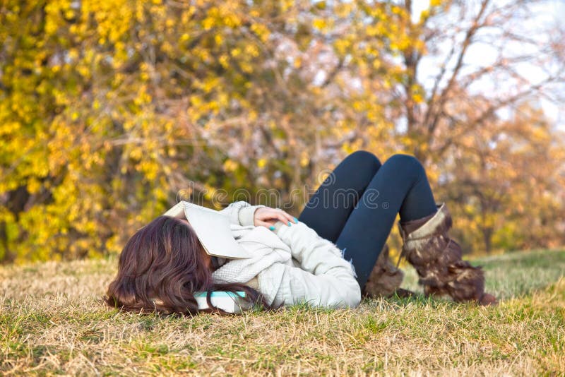 Beautiful Girl with Book Sleeping on Grass Stock Photo - Image of ...