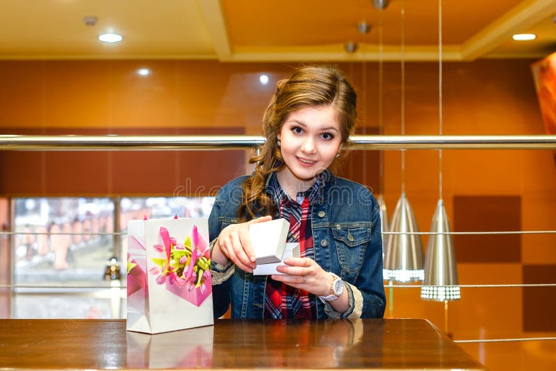 Beautiful Girl in the Cafe Opens White Gift Box Stock Photo - Image of ...