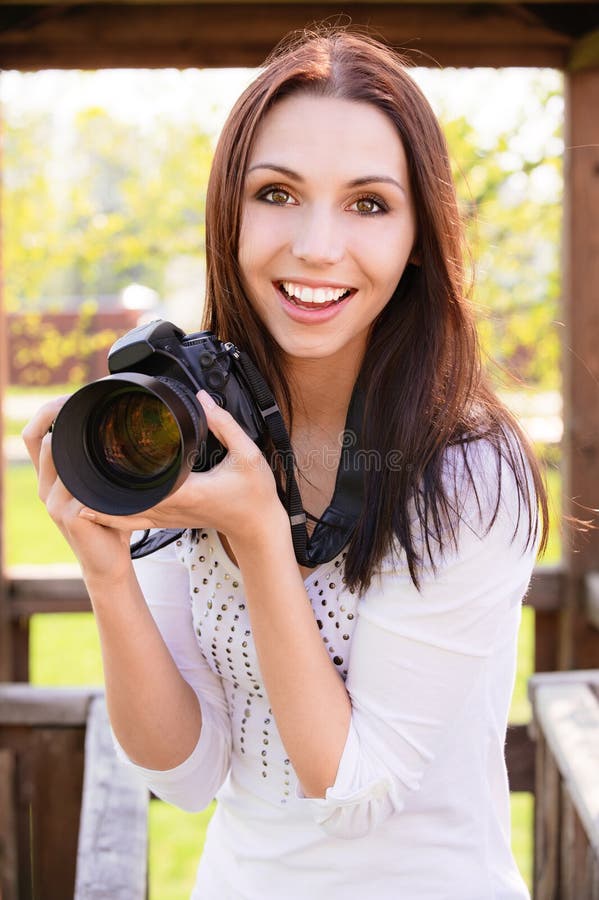 Teen girl with a camera stock image. Image of snap, outside - 13824249