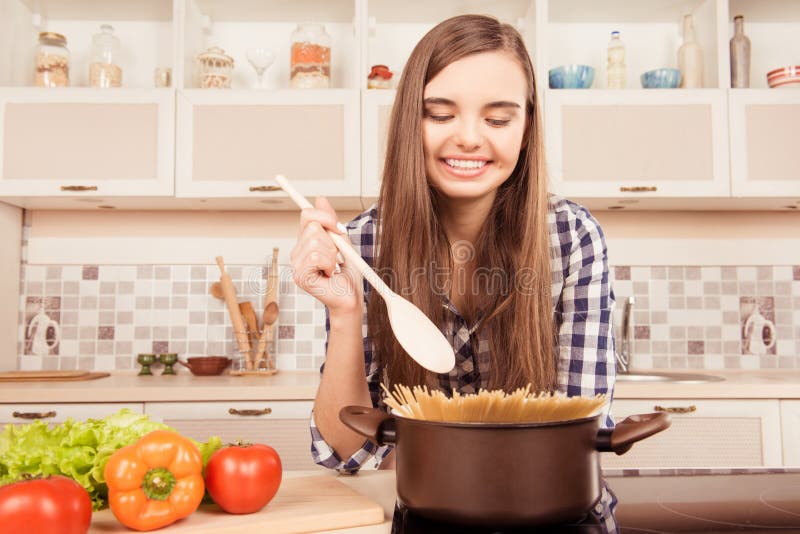 Beautiful Girl Cooking Pasta in the Kitchen Stock Image - Image of ...