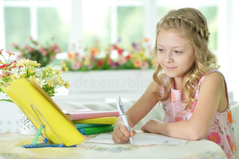 Beautiful Girl Doing Home Work at Table Stock Photo - Image of ...
