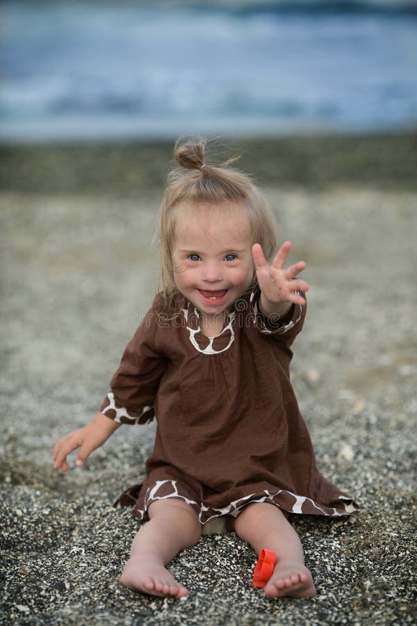Beautiful Girl with Down Syndrome on the Beach Stock Image - Image of ...