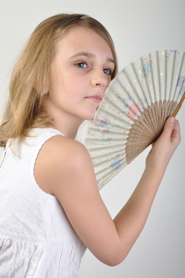 Beautiful girl with a fan stock image. Image of human - 22971945