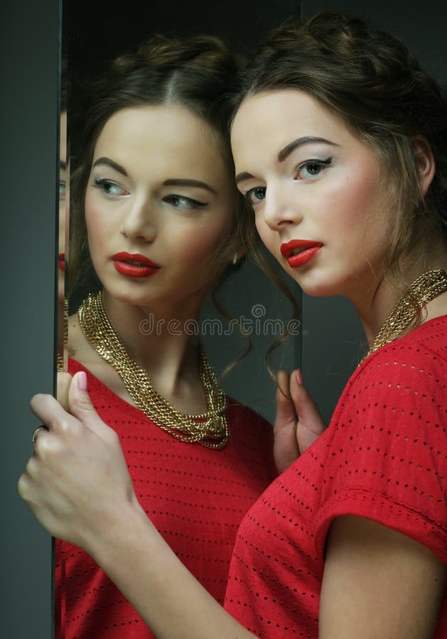 Beautiful Girl Female Model with Bright Makeup and Her Reflect Stock ...