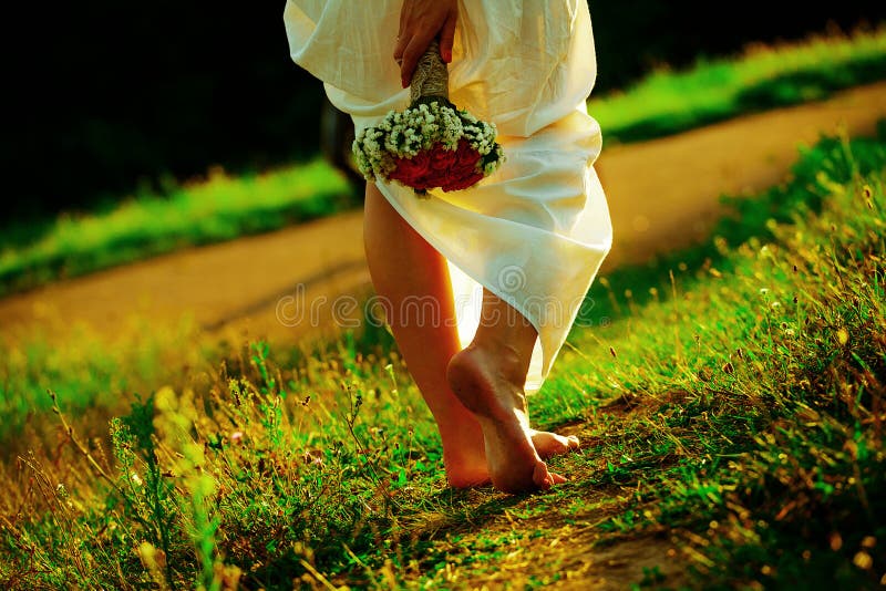 Beautiful Girl with Flowers Walking at Sunset Stock Image - Image of ...