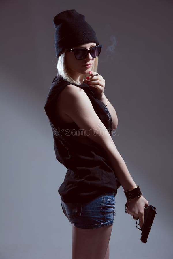 Beautiful Girl with a Gun in His Hand and Smoking a Cigarette Stock ...