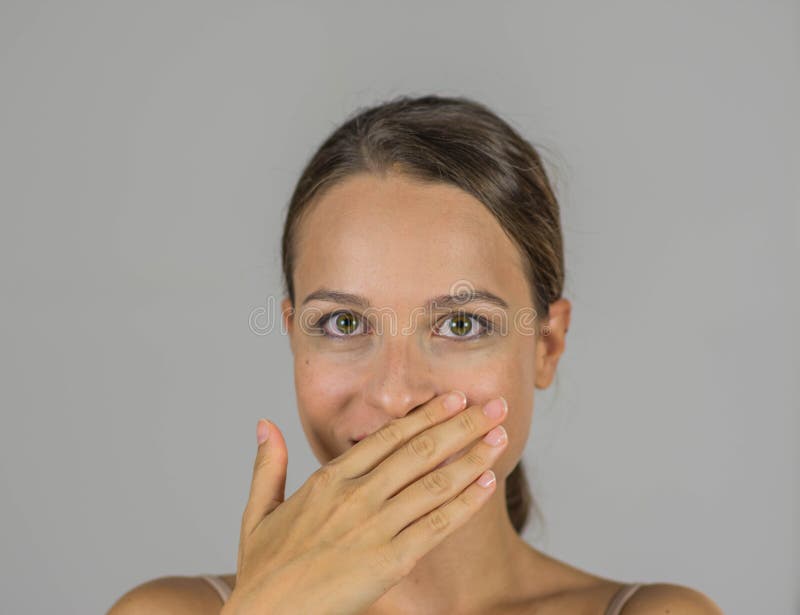 Beautiful Girl with Hand on Her Mouth Stock Image - Image of laugh ...