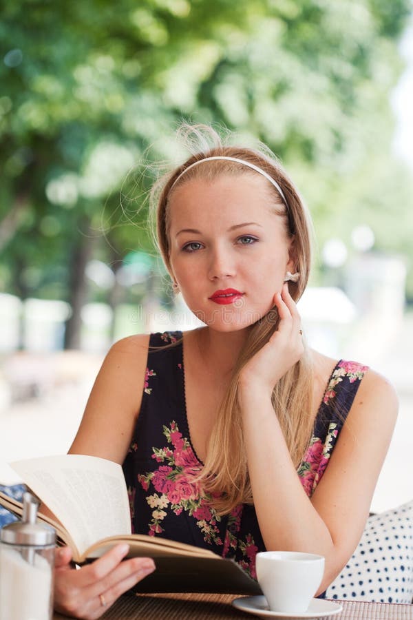 Beautiful girl has a rest stock image. Image of book - 21401403