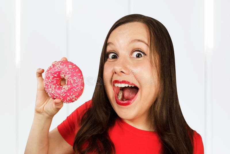 Beautiful Girl Holding Pink Donut an Having Fun Stock Photo - Image of ...