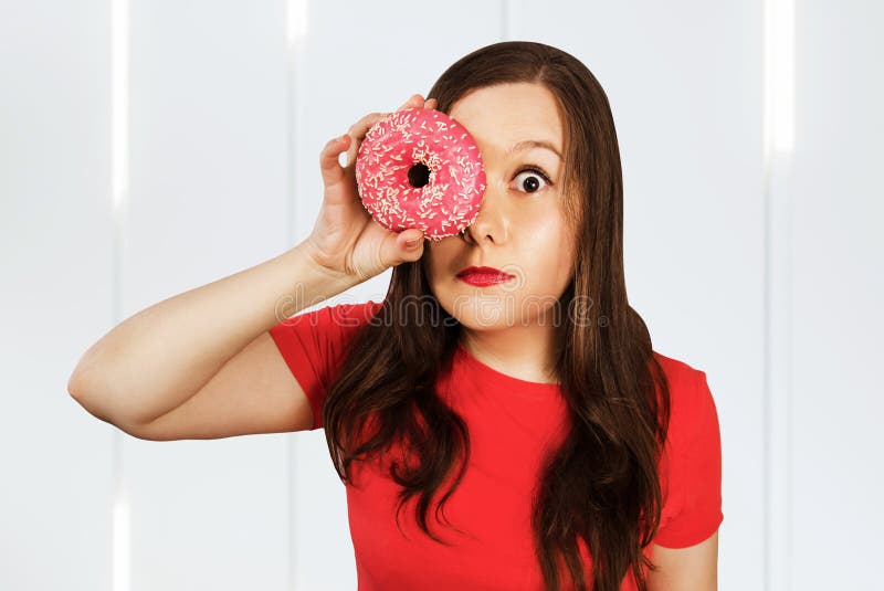 Beautiful Girl Holding Pink Donut an Having Fun Stock Photo - Image of ...