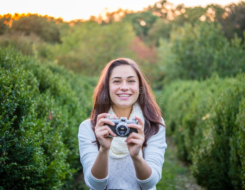 Beautiful Girl Laughing in the Park with a Camera in Her Hands Stock ...
