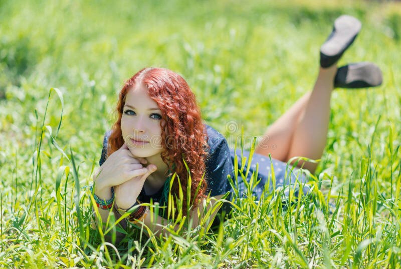 Beautiful Girl Lay on Grass. Stock Image - Image of closeup, eyes: 79082745