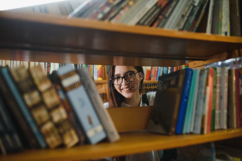 Beautiful Girl in a Library Stock Photo - Image of smiling, indoor ...