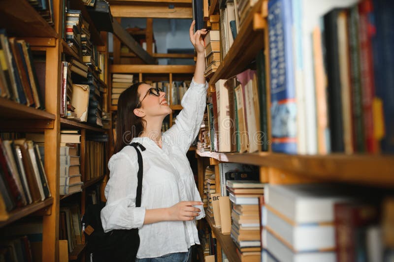 Beautiful Girl in a Library Stock Photo - Image of campus, people ...