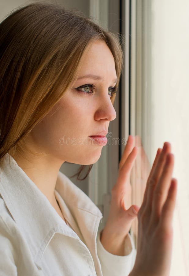 Sad Girl Looking Out the Window Waiting for Her Husband Stock Image ...