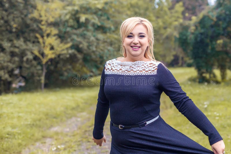 Beautiful Girl Model in a Park, Posing for Photo Camera. Stock Photo ...