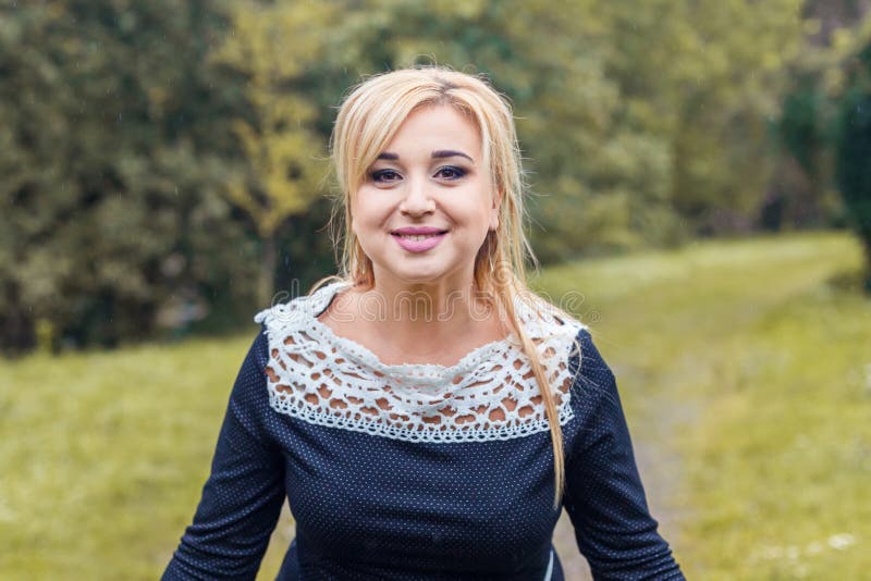 Beautiful Girl Model in a Park, Posing for Photo Camera. Stock Photo ...