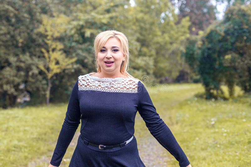 Beautiful Girl Model in a Park, Posing for Photo Camera. Stock Photo ...