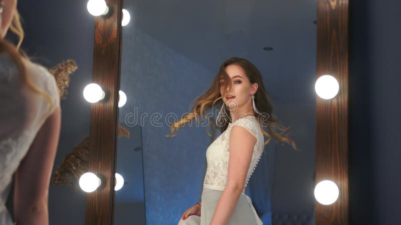Beautiful Girl Model Posing in Front of a Mirror. Stock Photo - Image ...