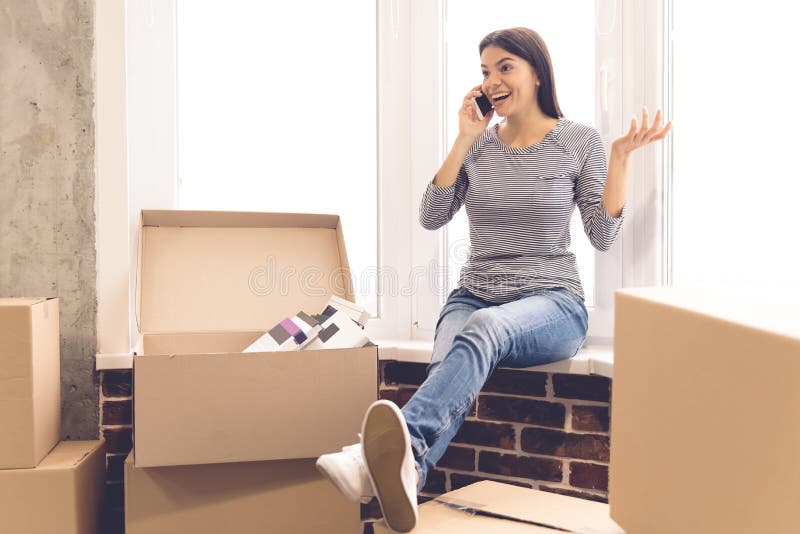 Teen Girl Moving House To College, Holding Pile Books and Plant Stock ...