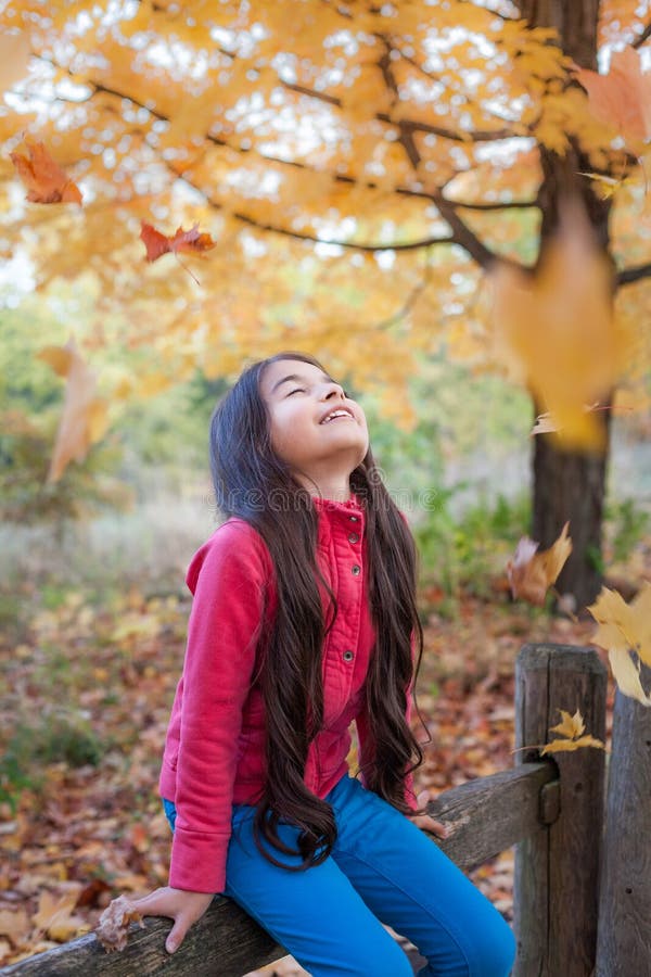Beautiful Girl Playing with Maple Leaves in Fall Park Stock Image ...